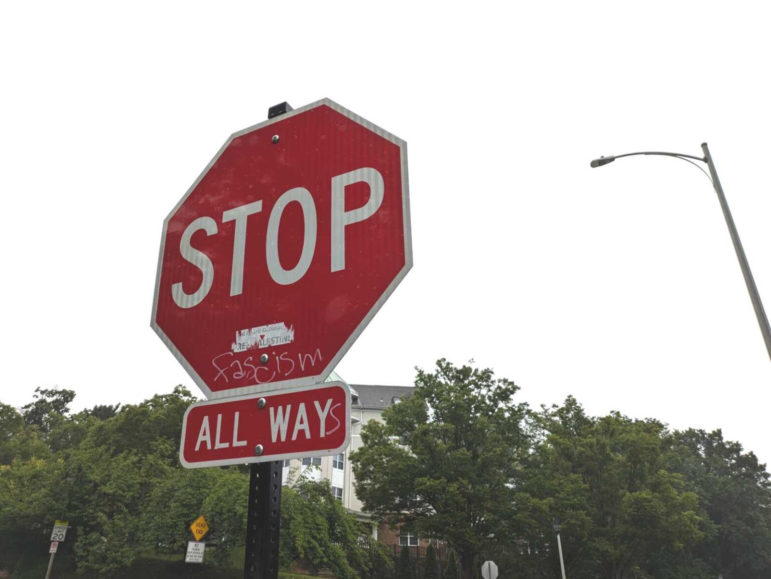 ‘Stop fascism’ graffiti reported on dozens of Arlington signs | ARLnow.com