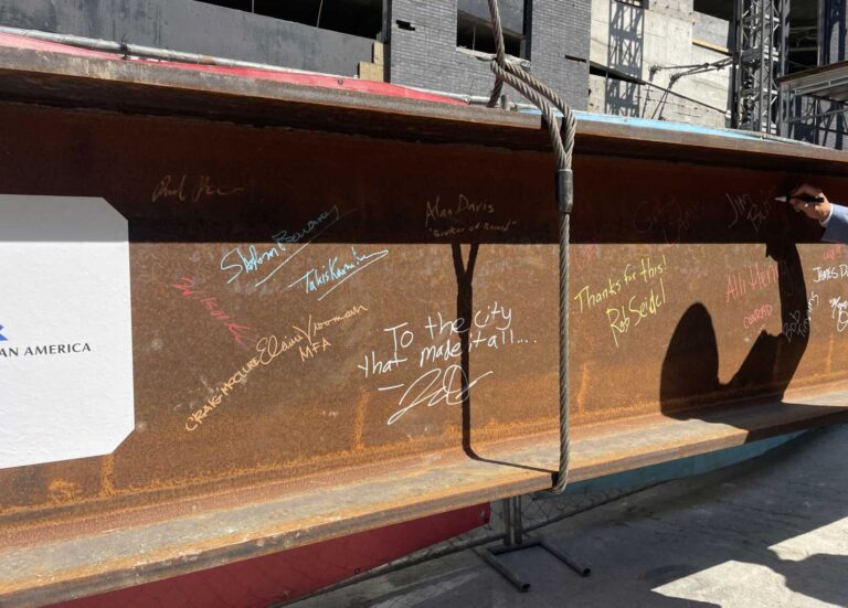 New 422-unit pair of apartment towers receives its final beam in ...